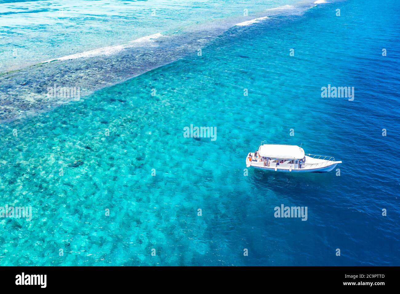 Beautiful turquoise ocean water boat top view aerial photo. Aerial view ...