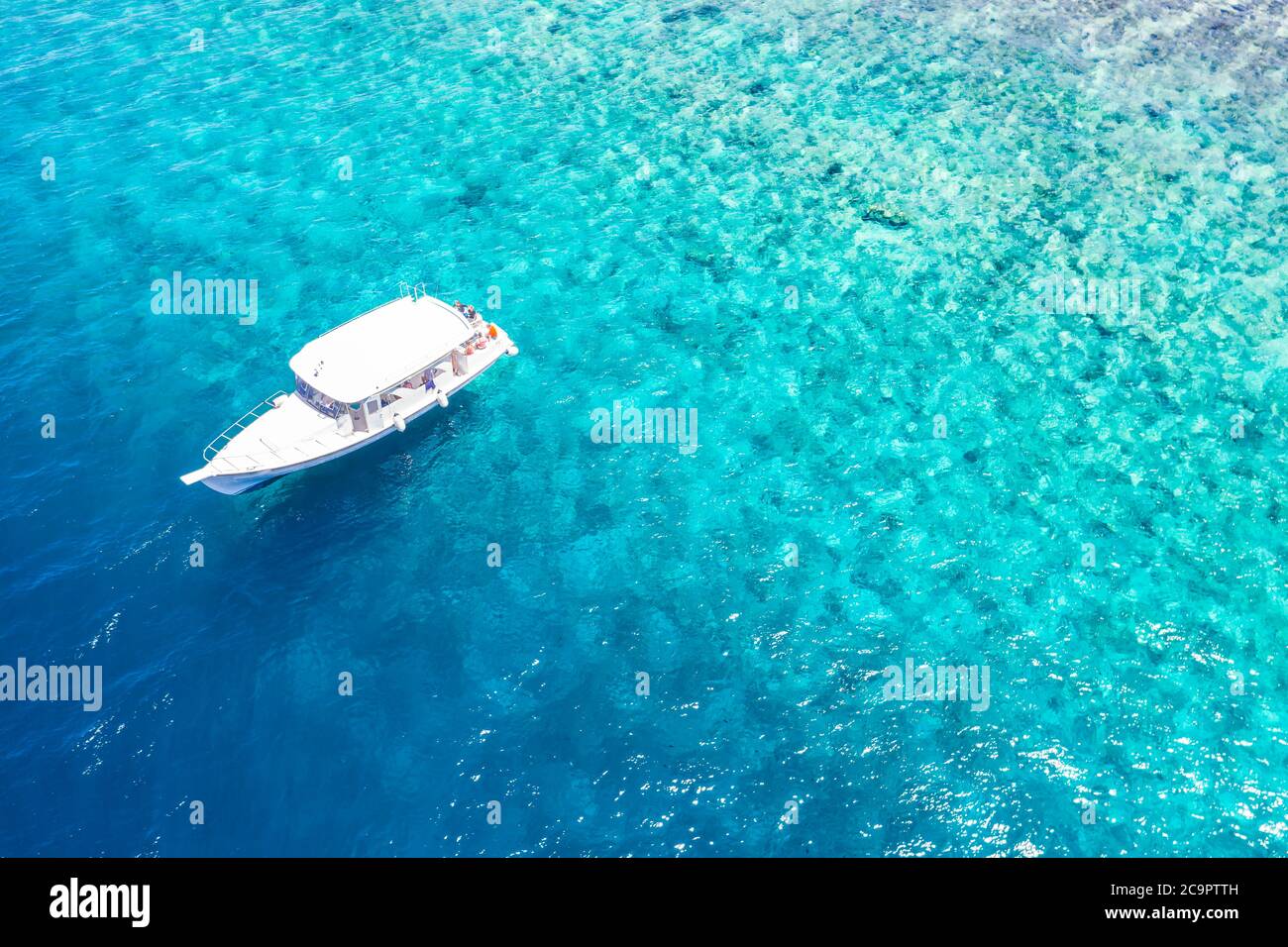 Beautiful turquoise ocean water boat top view aerial photo. Aerial view ...