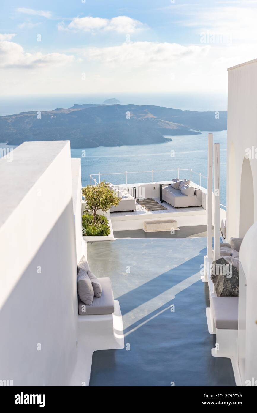 Peaceful view in Santorini, Greece with white architecture and flowers ...