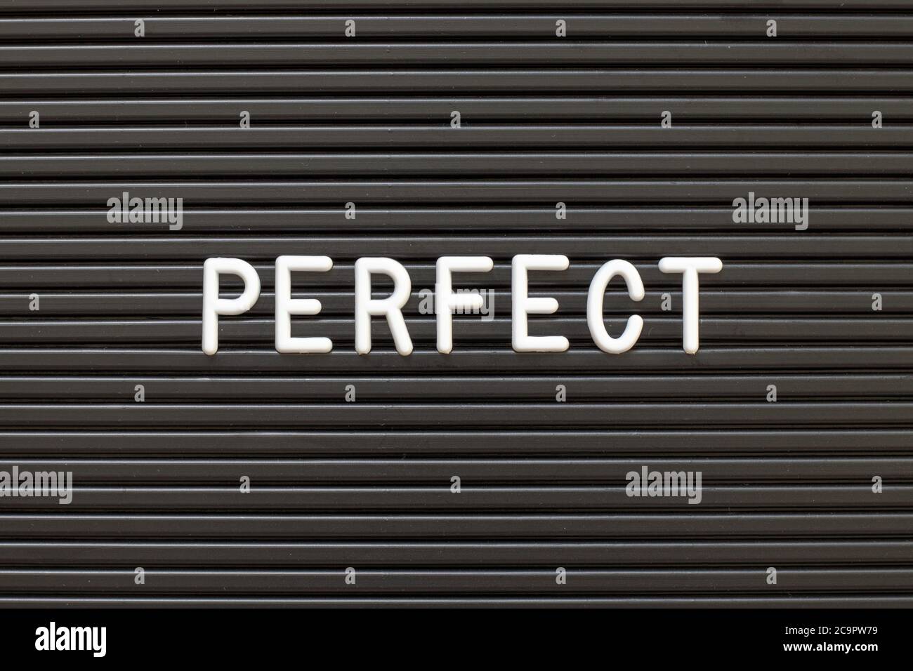 Black color felt letter board with white alphabet in word perfect ...