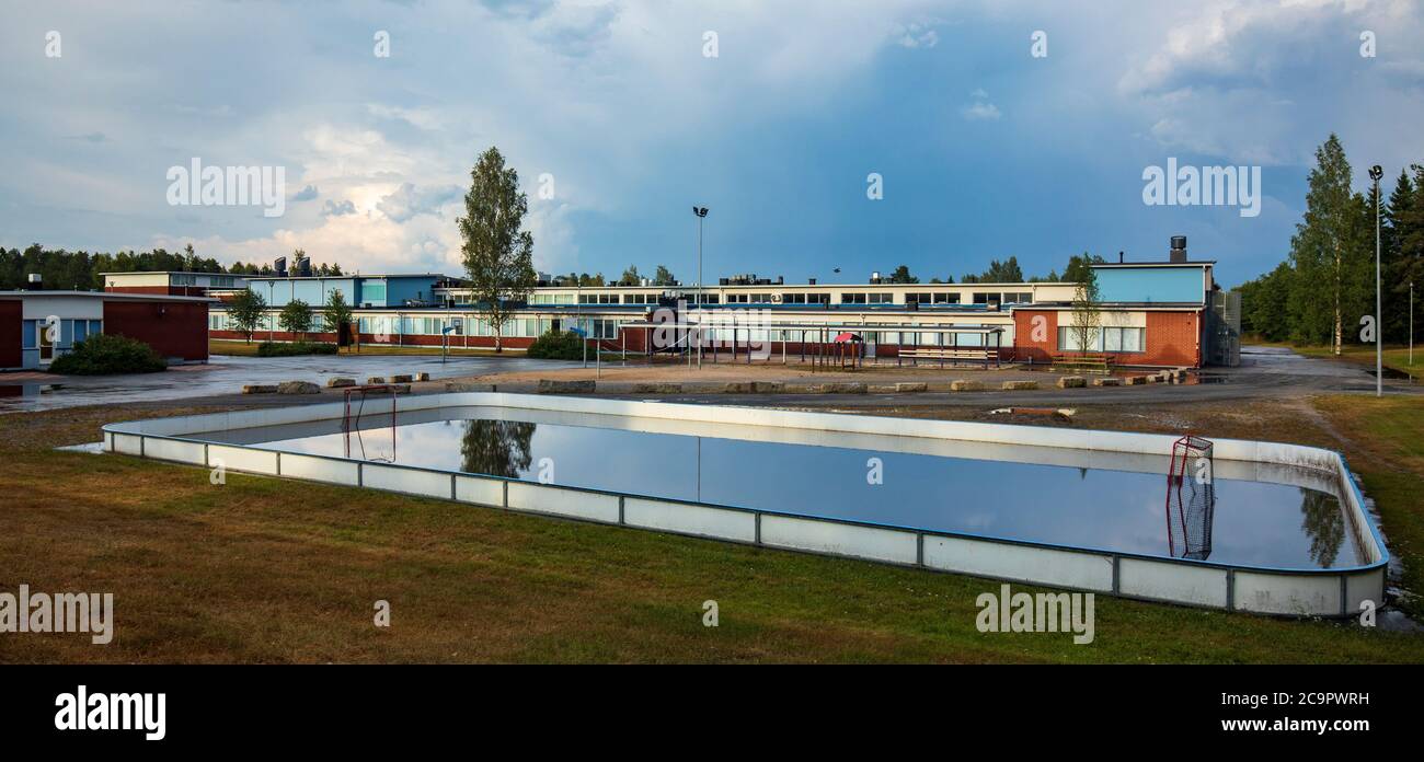 View of water-filled outdoor floorball court at schoolyard , Finland ...