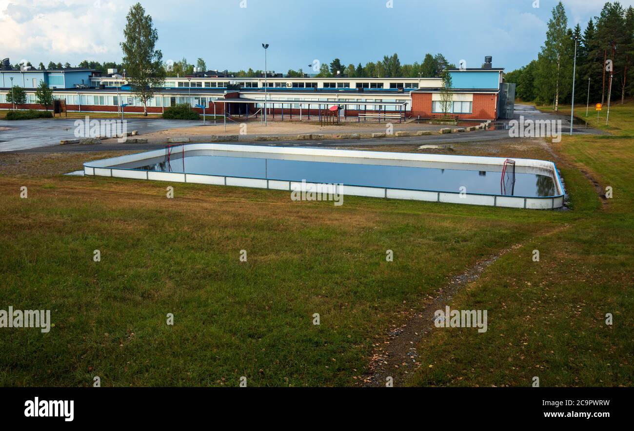 View of water-filled outdoor floorball court at schoolyard , Finland ...