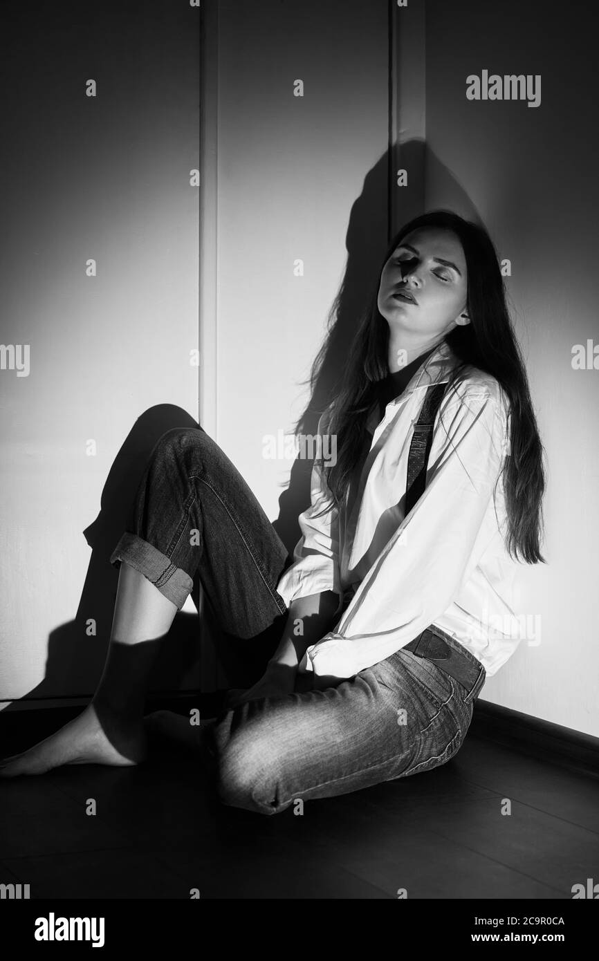 Person sitting on corner Black and White Stock Photos & Images - Alamy