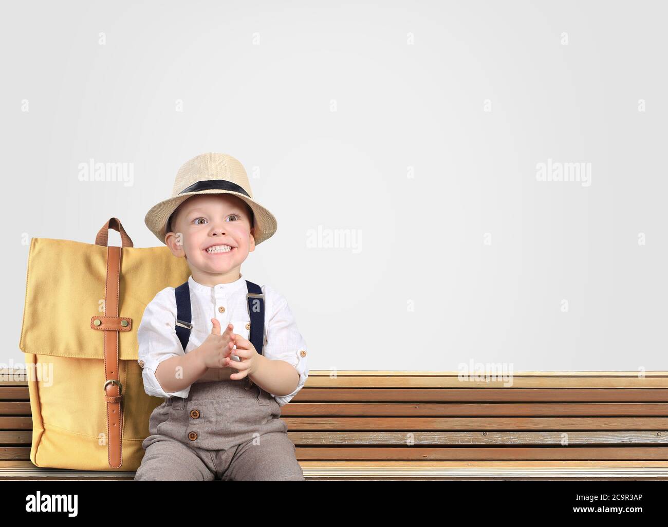 Cute little boy in a hat and trousers with suspenders Stock Photo - Alamy