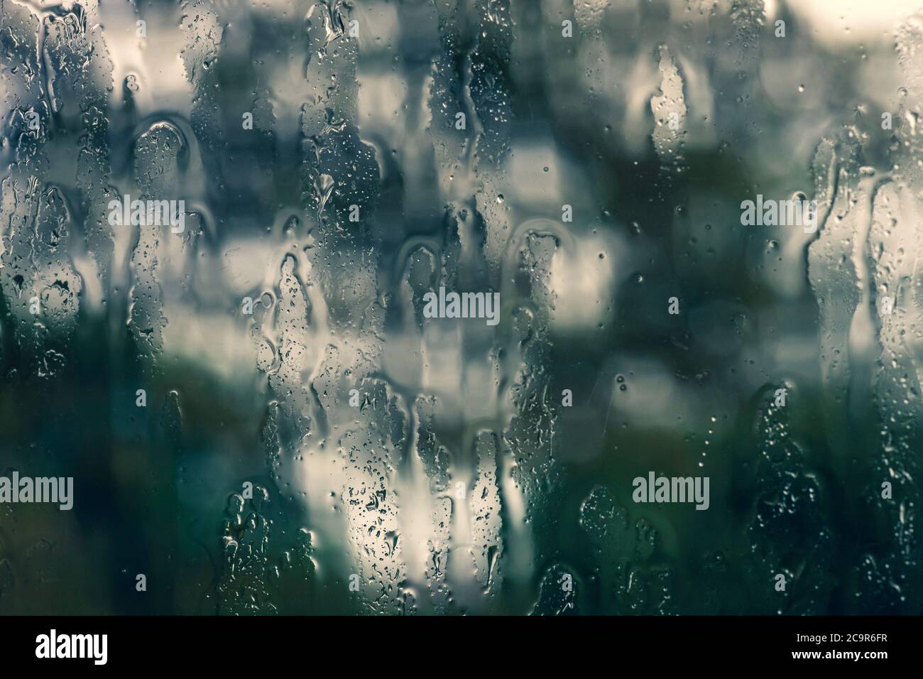 Abstract autumn background with drips of rain outside of window. Rainy ...