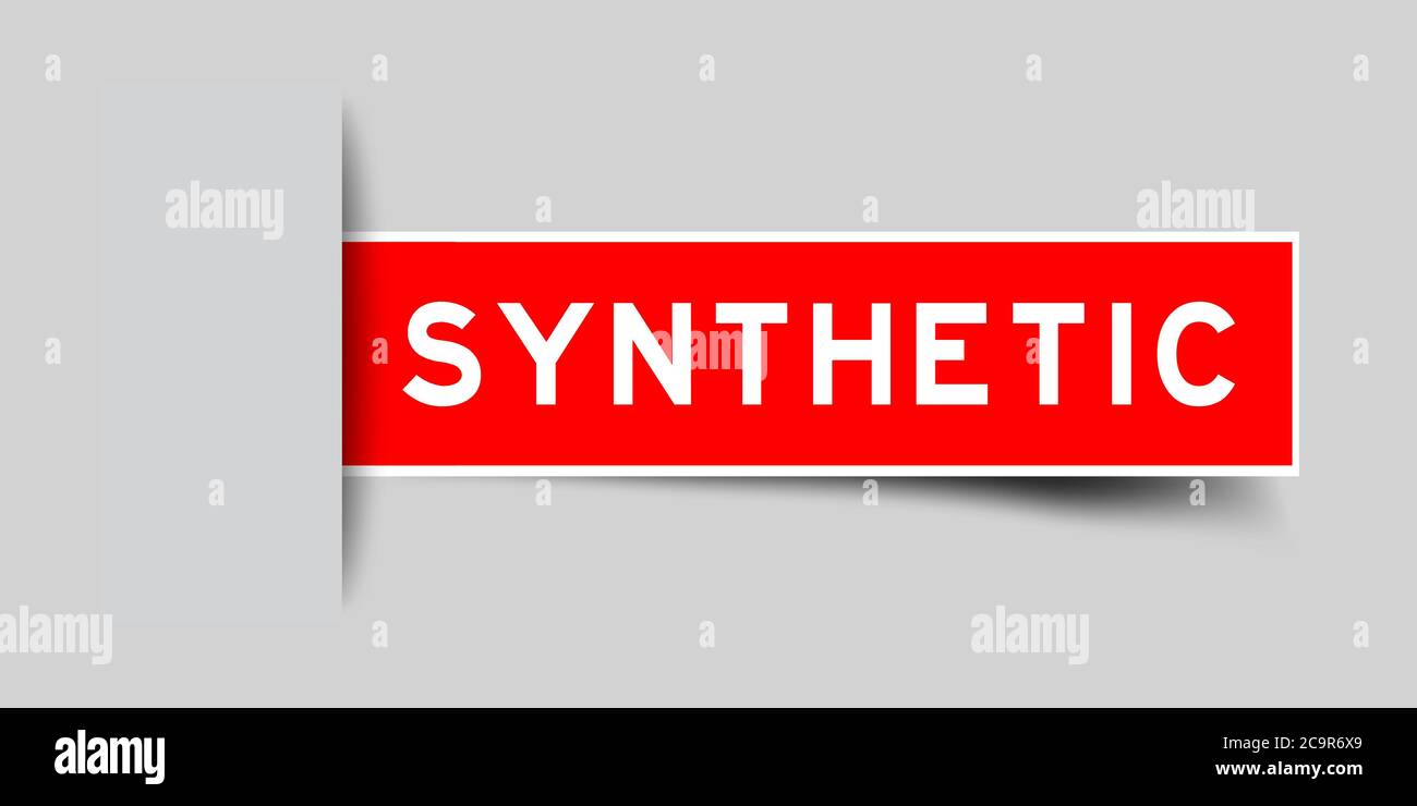 Inserted red color sticker label with word synthetic on gray background ...
