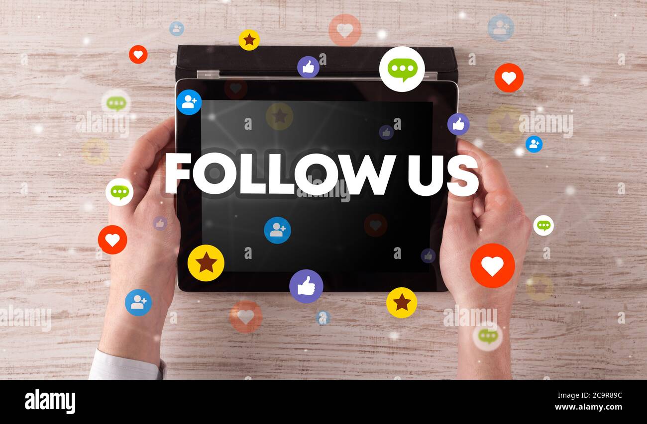 Close-up of a touchscreen with FOLLOW US inscription, social networking ...