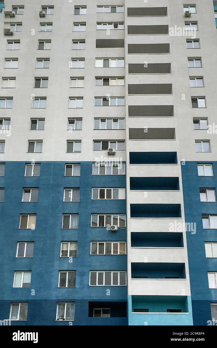 Facade of typical high rise apartment building with balcony and windows ...