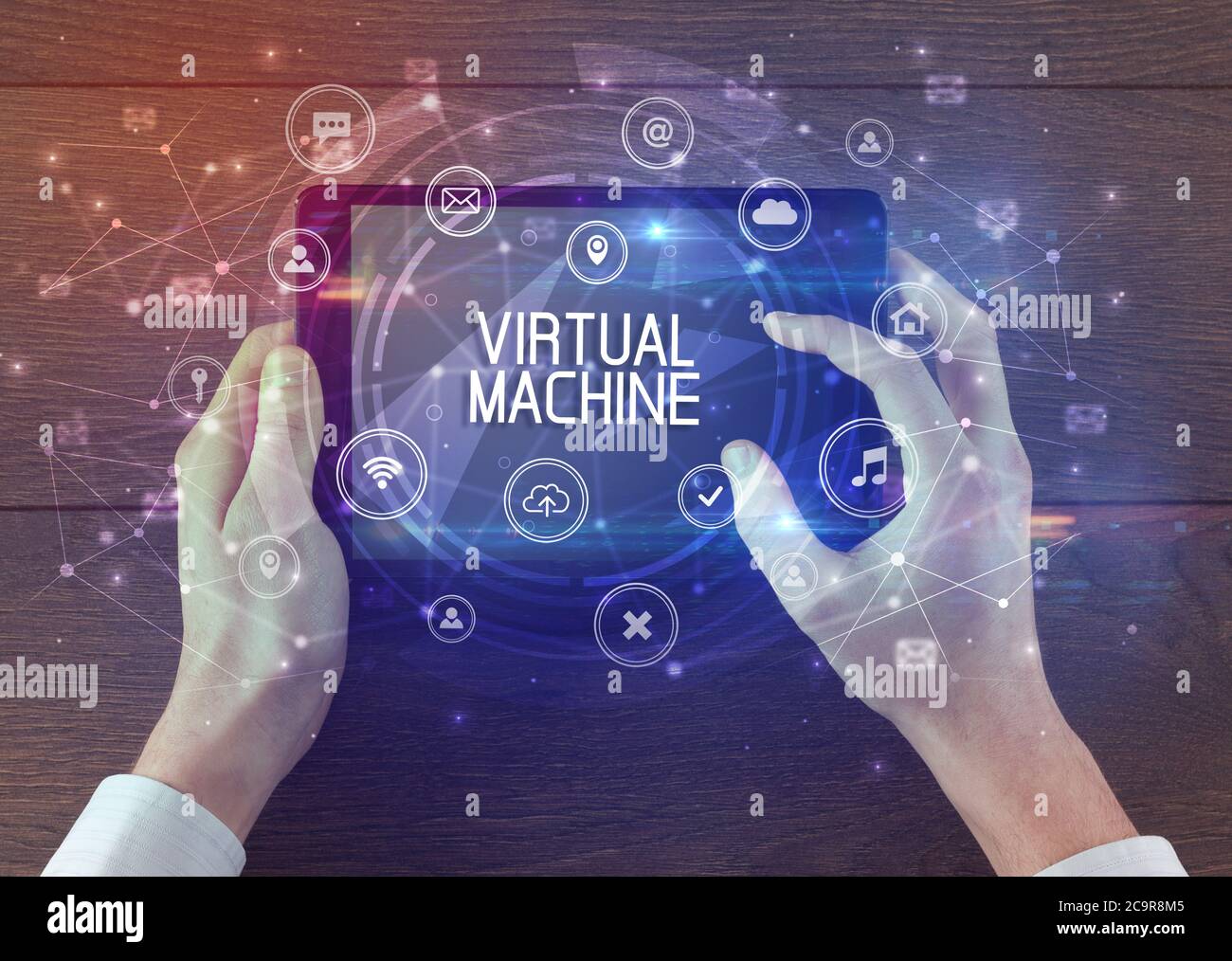 Close-up of a tablet with VIRTUAL MACHINE inscription, innovative ...