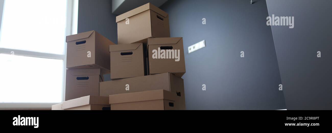 Empty office interior, boxes stand near window Stock Photo - Alamy