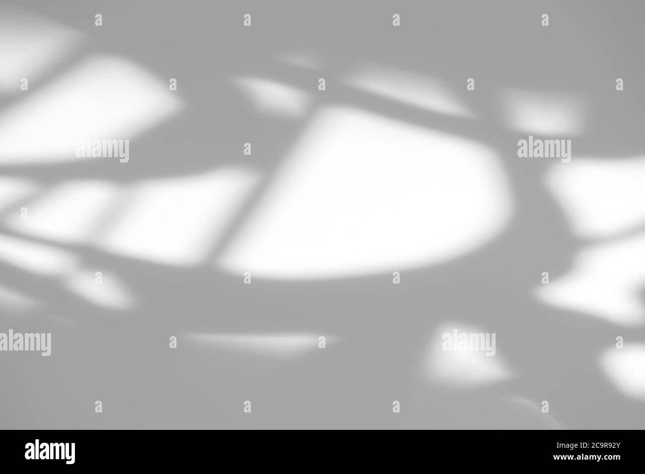 Organic drop shadow on a white wall Stock Photo - Alamy