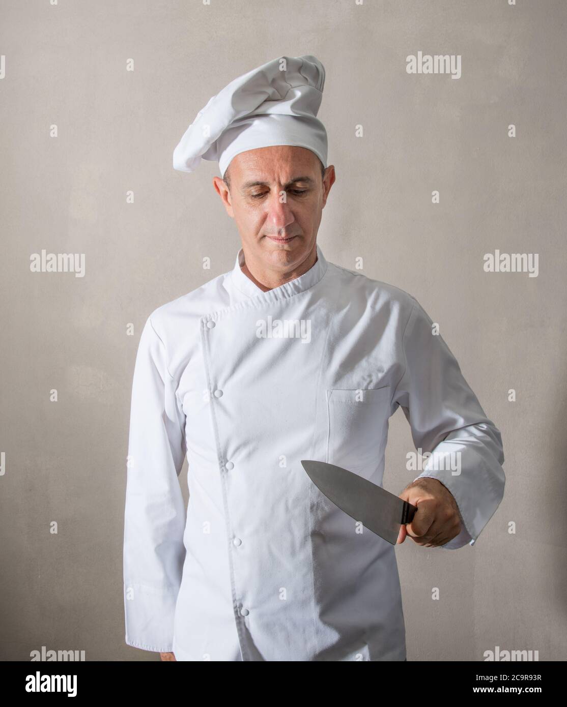 a professional chef with a knife Stock Photo - Alamy