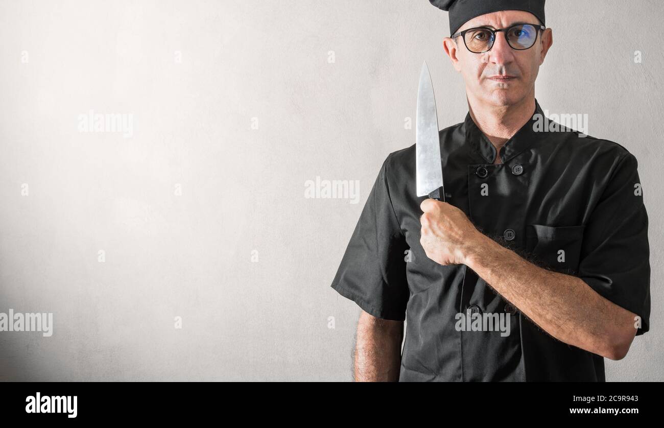 an italian chef with big knife Stock Photo - Alamy