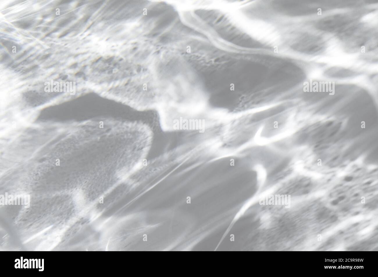 shadow and light caustic effect on a white wall Stock Photo - Alamy