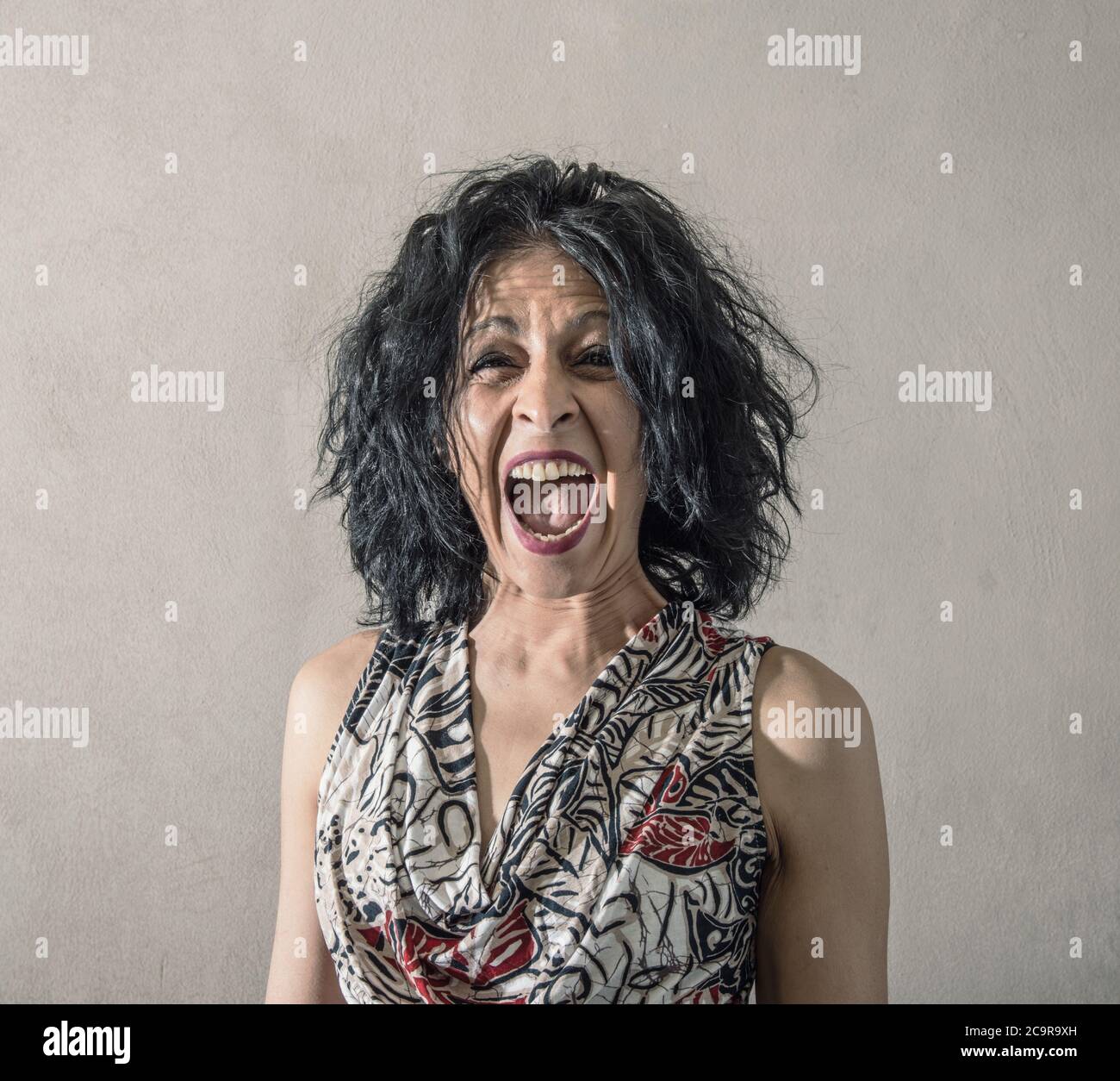 a Very stressed woman screaming Stock Photo - Alamy