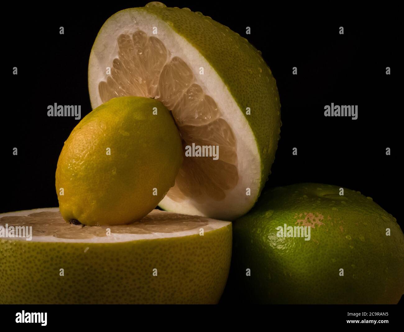 citrus fruit composition on black background Stock Photo - Alamy