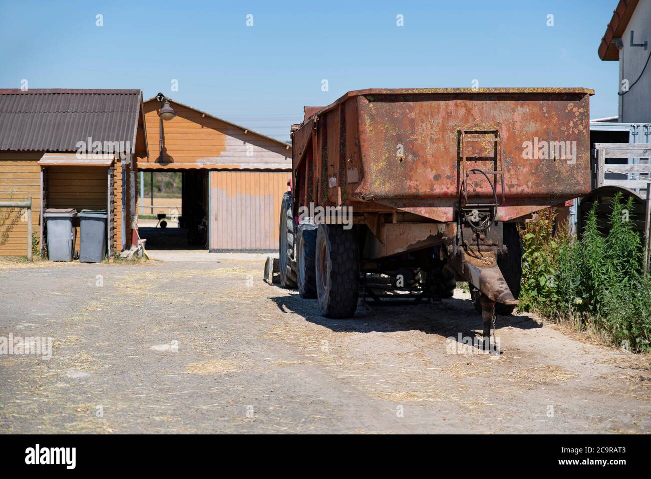 Industrial building of a farm with a trailer Stock Photo - Alamy
