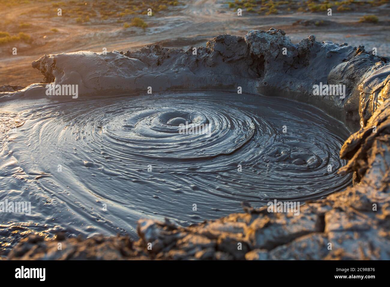 Bubbling crater of a mud volcano. Active mud volcano in Gobustan desert ...