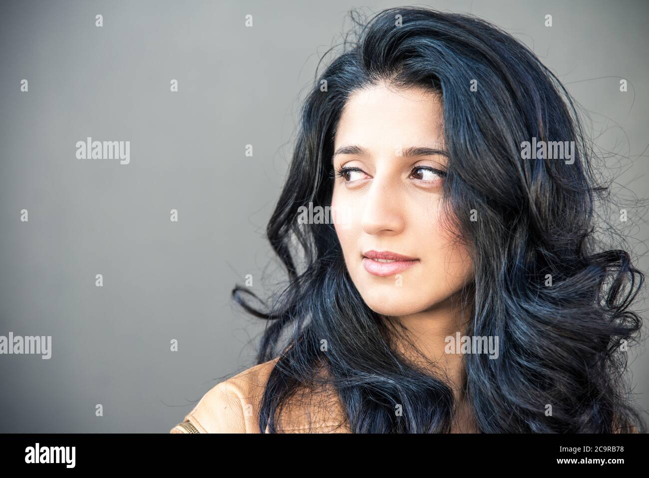 beautiful brunette girl with intense look Stock Photo - Alamy