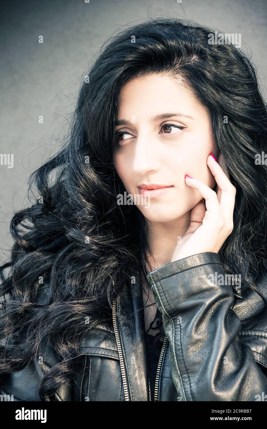 beautiful brunette girl with intense look Stock Photo - Alamy