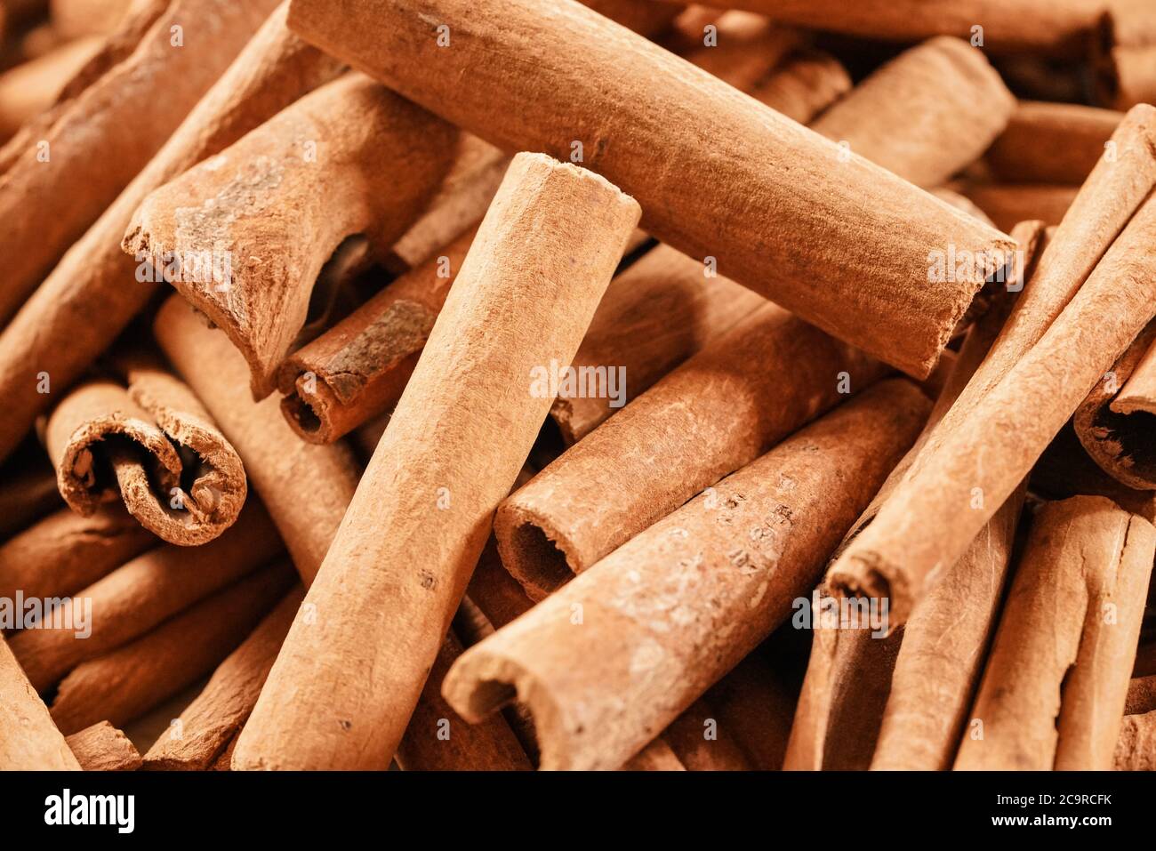 Organic cinnamon stick pile - close up photo Stock Photo - Alamy