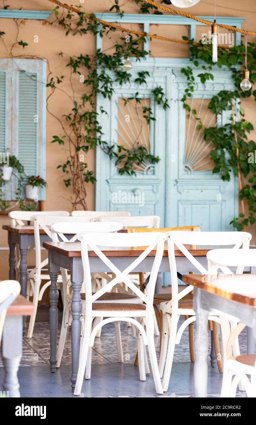 Mediterranean restaurant terrace exterior with chairs. Holiday travel ...