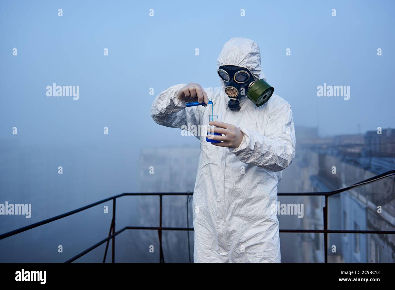 Researcher of the laboratory is conducting the study with blue reagent ...