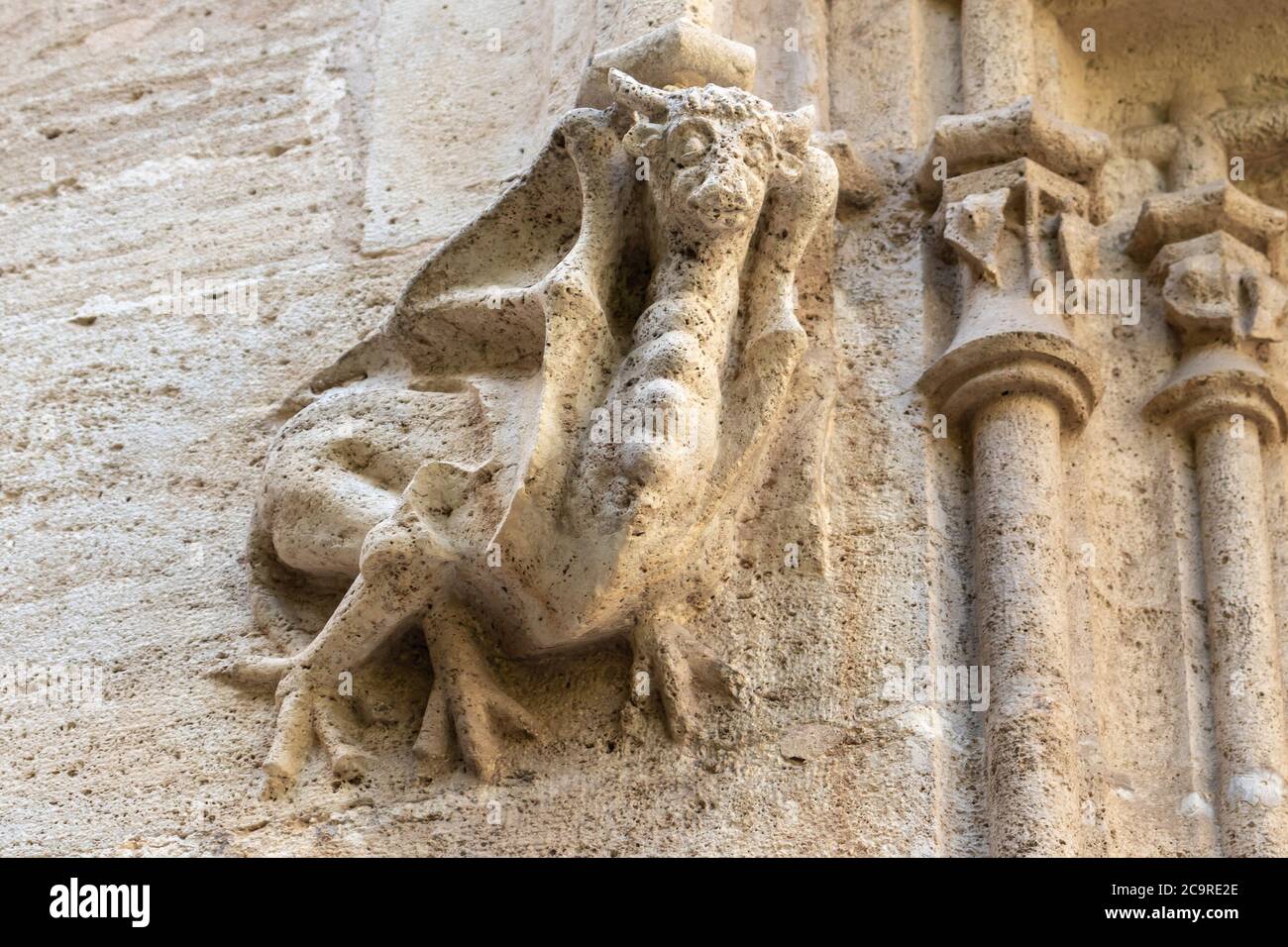 Gothic gargoyle bas relief on an ancient historical building in ...