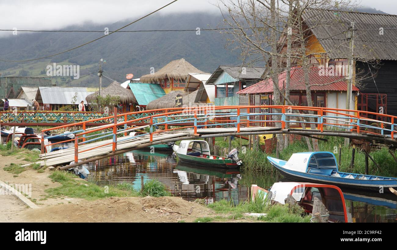 Laguna de la Cocha at El Encano with wooden briges and stilt houses ...