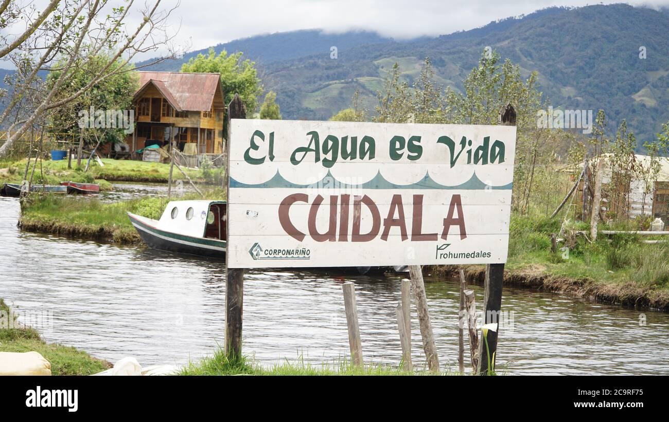 Laguna de la Cocha at El Encano with wooden briges and stilt houses ...