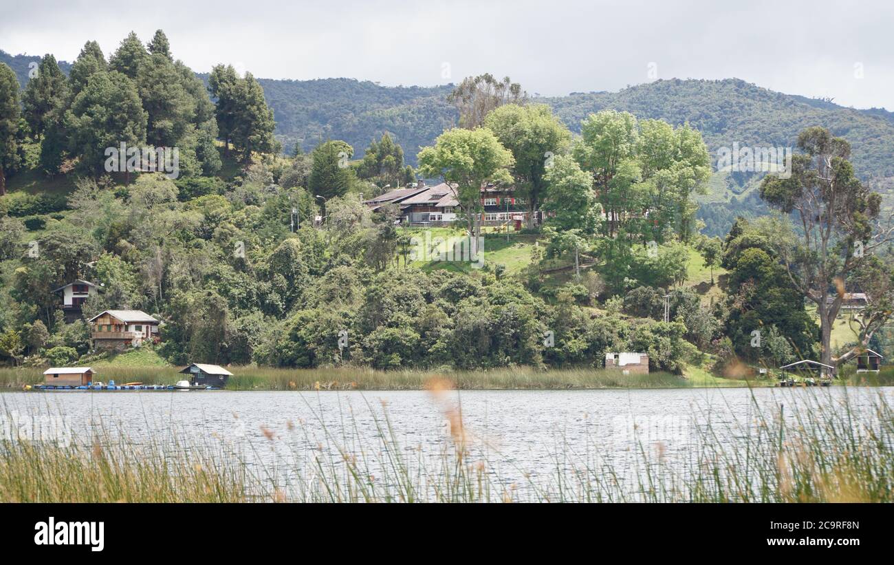 Laguna de la Cocha at El Encano with wooden briges and stilt houses ...