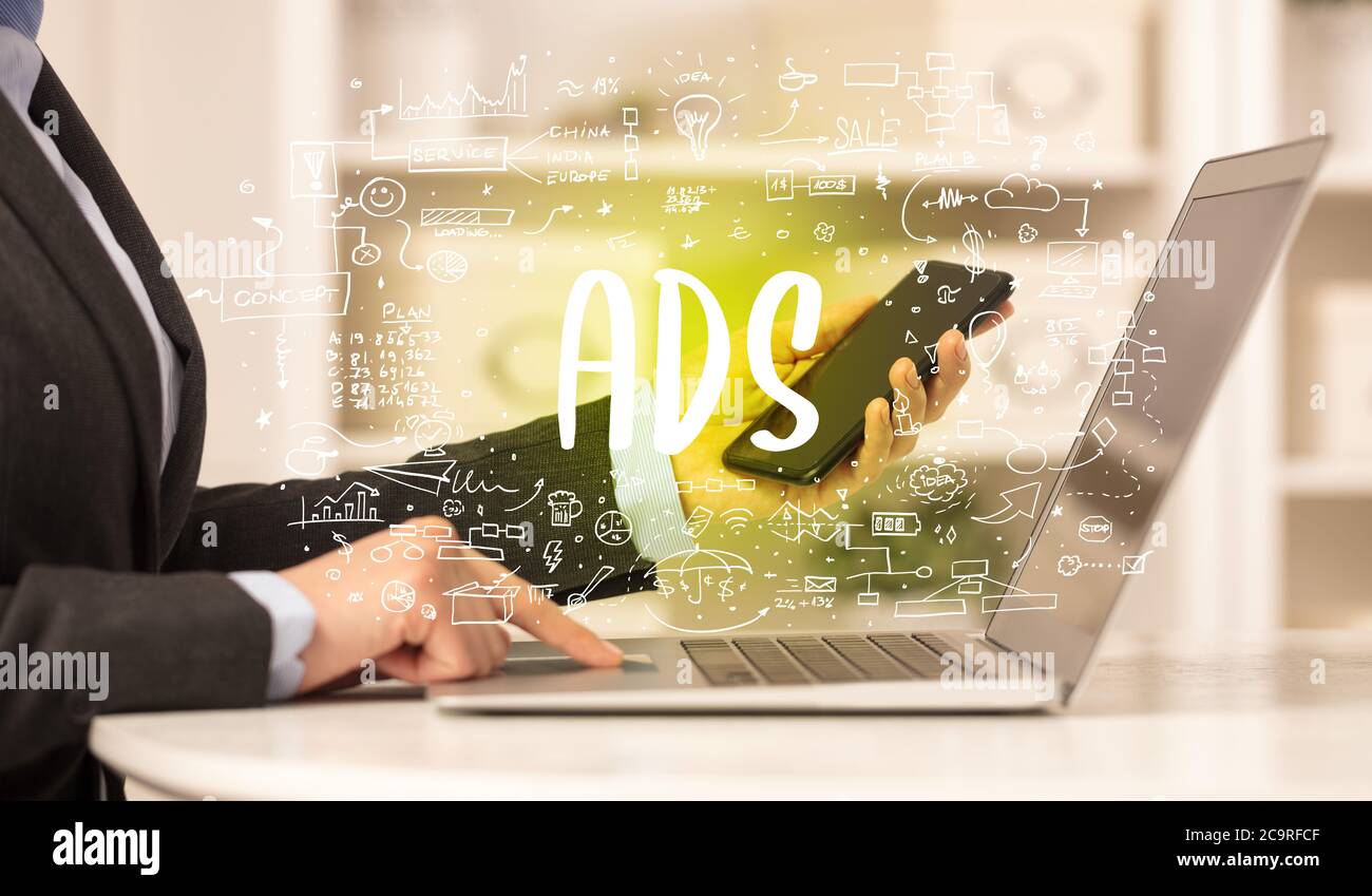 hand working on new modern computer with ADS abbreviation, modern ...
