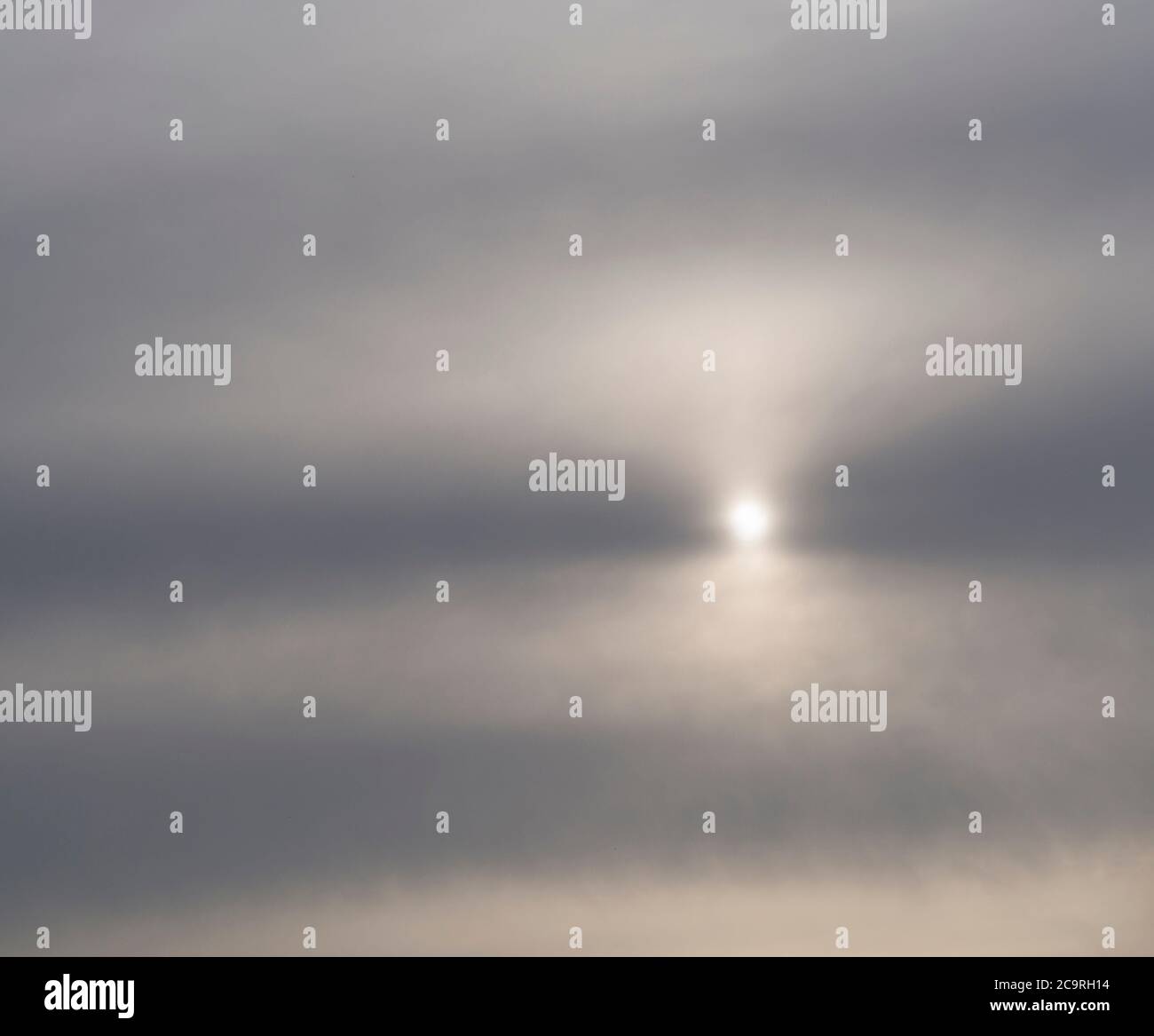 misty faded sun light gray pink blue sky background Stock Photo - Alamy