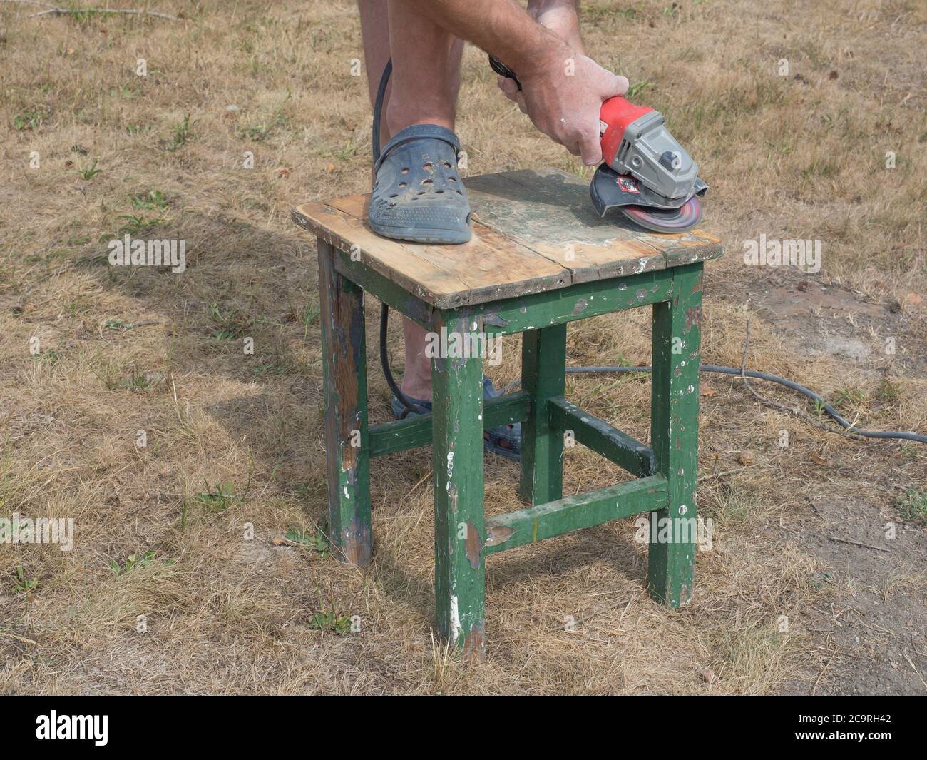 The man hands working with eletric grinder machine, tool for grinding ...