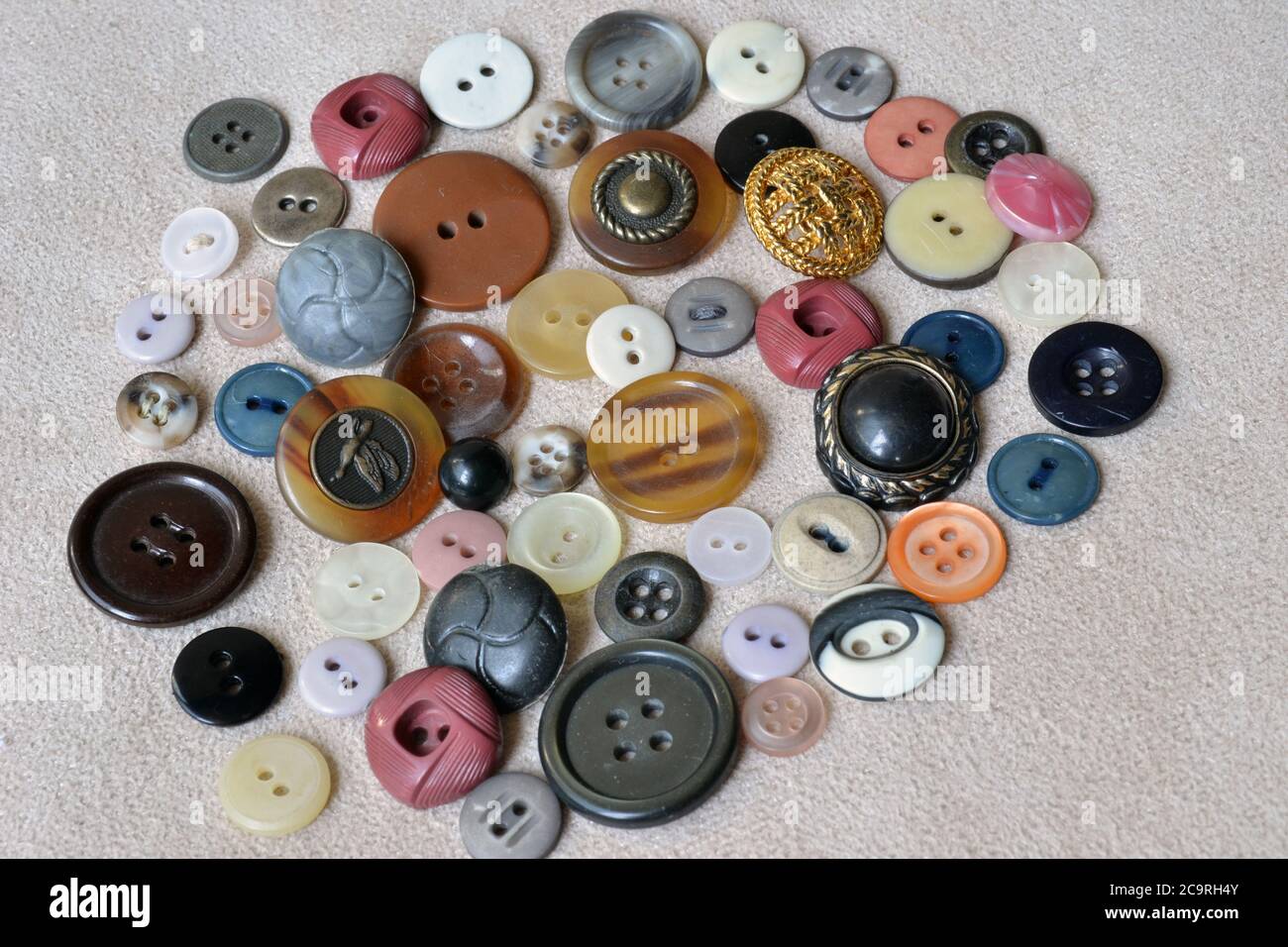 Lot of buttons different in size and color Stock Photo - Alamy
