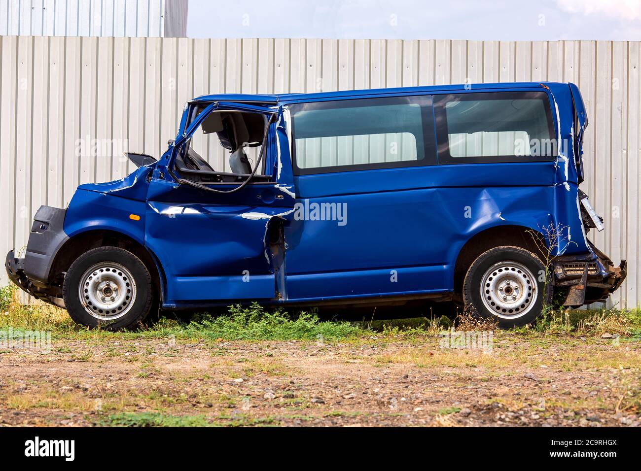The crash car, broken minibus after accident. Failed blue van on ...