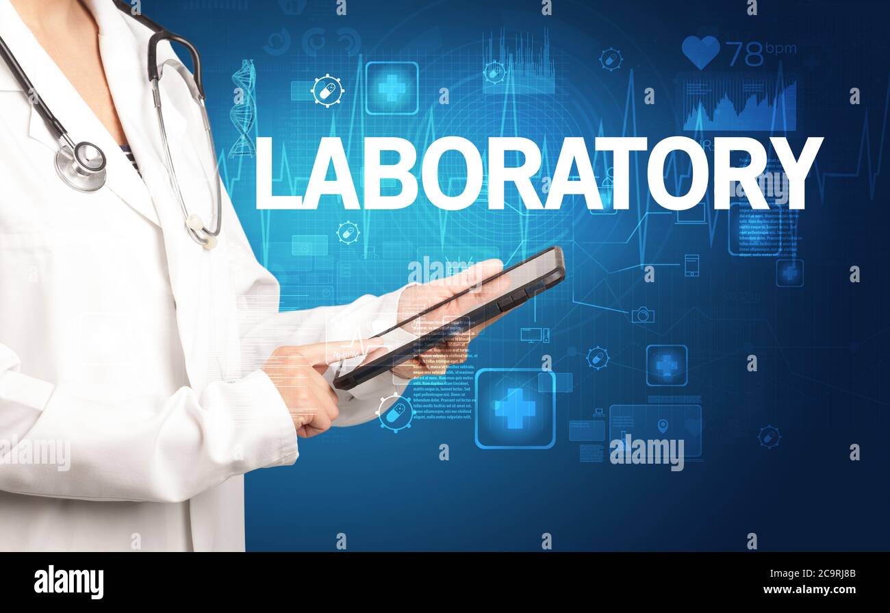 young doctor writing down notes with LABORATORY inscription, healthcare ...