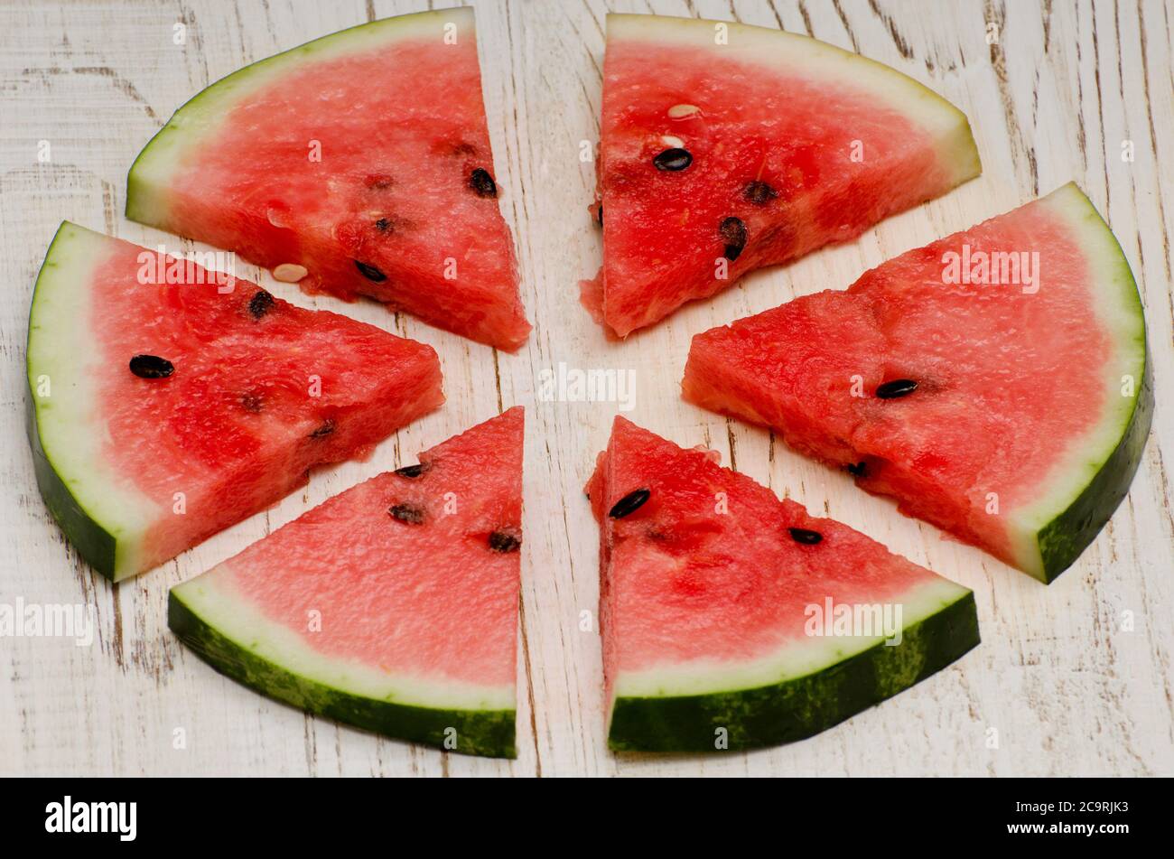 Circle watermelon cut into slices Stock Photo - Alamy