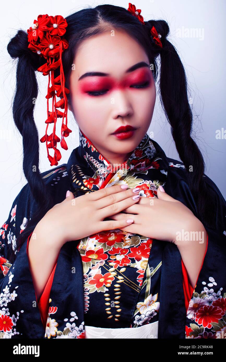 young pretty geisha in black kimono with sakura, asian ethno closeup on ...