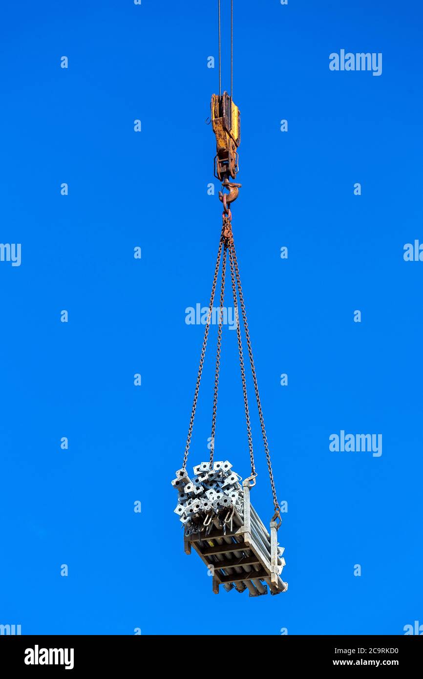 Crane lifting pipes hi-res stock photography and images - Alamy