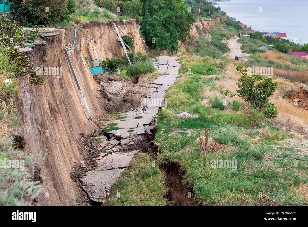 landslides cracks in the asphalt road after a geological natural ...