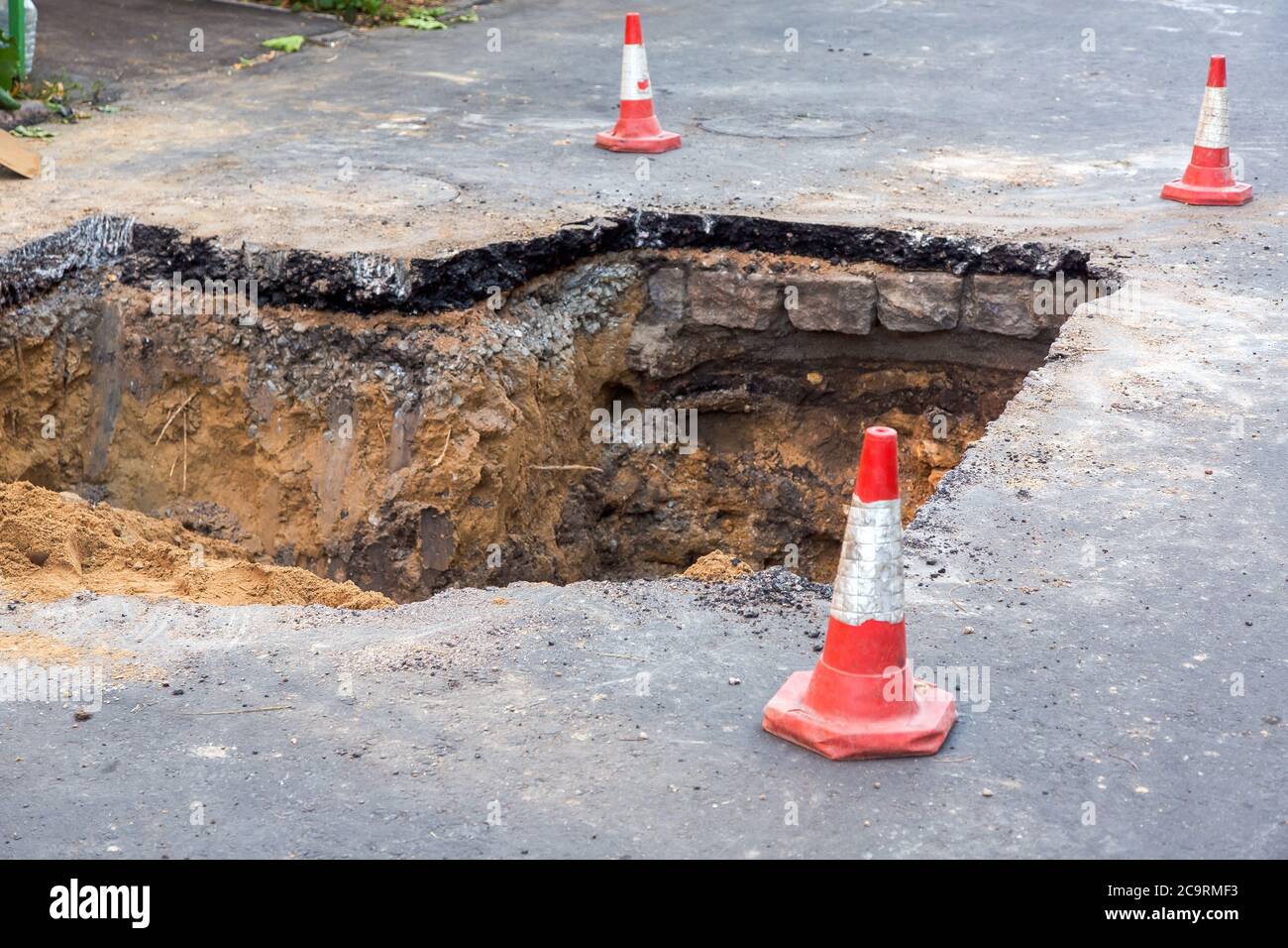 The road repair and caution with blocked barrier over concrete digging ...