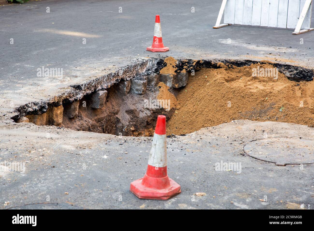 The road repair and caution with blocked barrier over concrete digging ...
