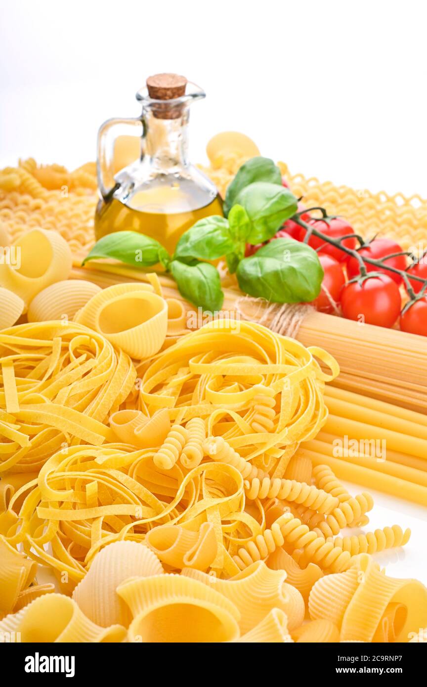 A group of different types of Italian pasta. Pasta with fresh tomatoes ...
