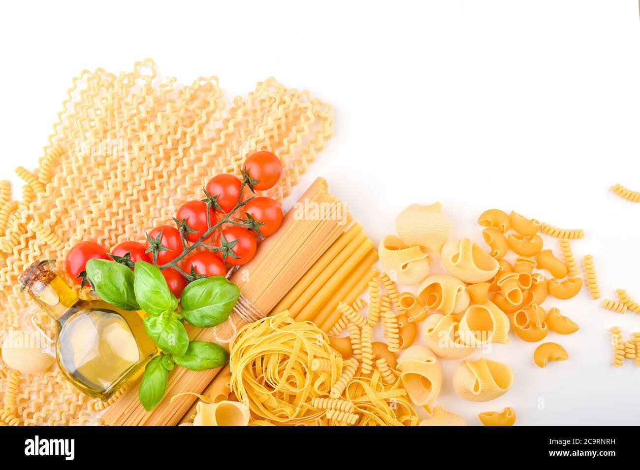 A group of different types of Italian pasta. Pasta with fresh tomatoes ...