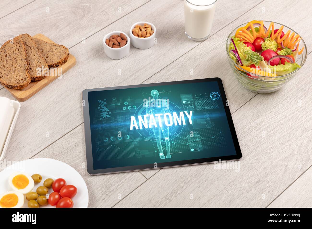 ANATOMY concept in tablet with fruits, top view Stock Photo - Alamy