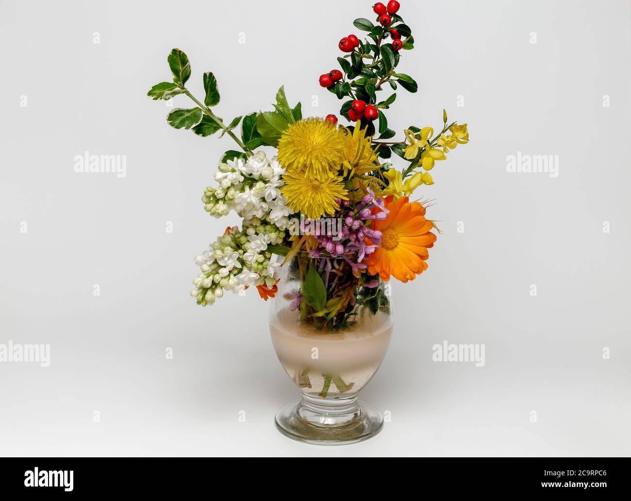 a colourful bouquet of spring flowers in a vase Stock Photo - Alamy