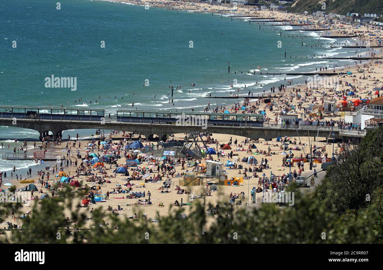 People on the beach at Bournemouth as the hot weather continues Stock ...