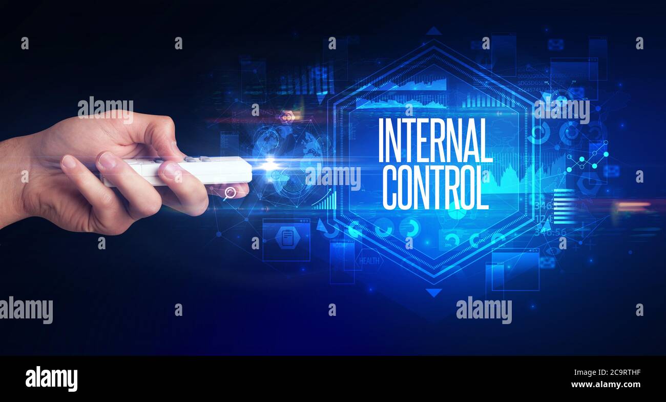 hand holding wireless peripheral with INTERNAL CONTROL inscription ...