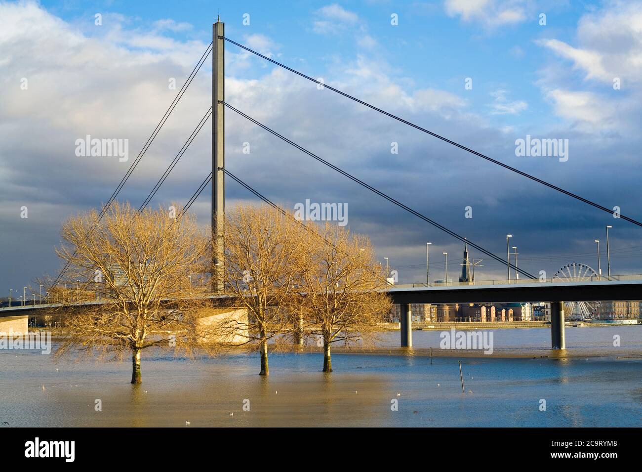 Climate change, flooding, inundation of a river, city in the backgound ...